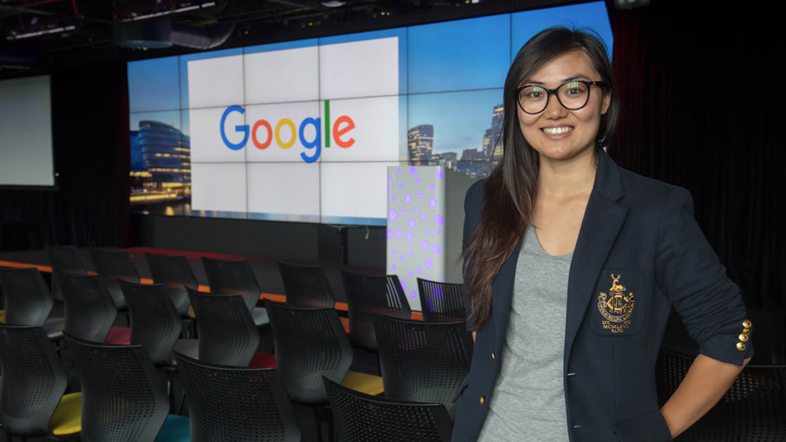 Susan Zhang holds up a torch - University of Wollongong – UOW